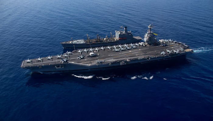 Iran issues 'all-out war' warning as US 'armada' advances